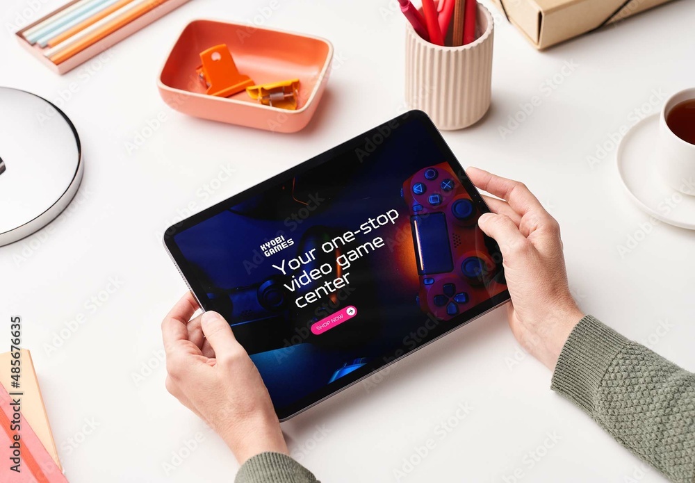 Using iPad on White Table Mockup Stock Template | Adobe Stock