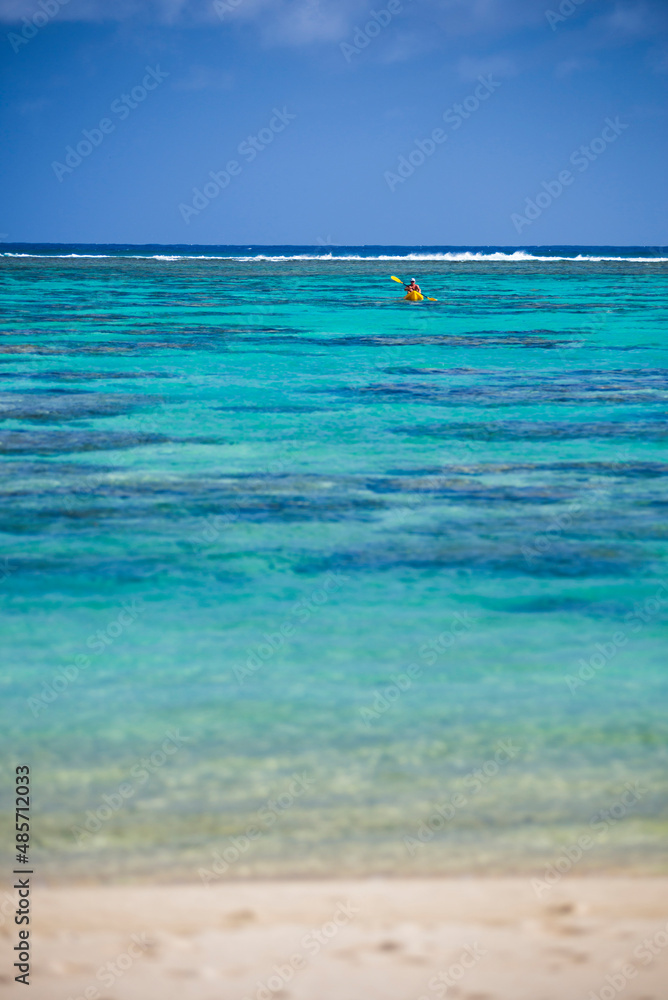 Kayaking in the beautiful blue tropical ocean of Titikaveka Lagoon ...