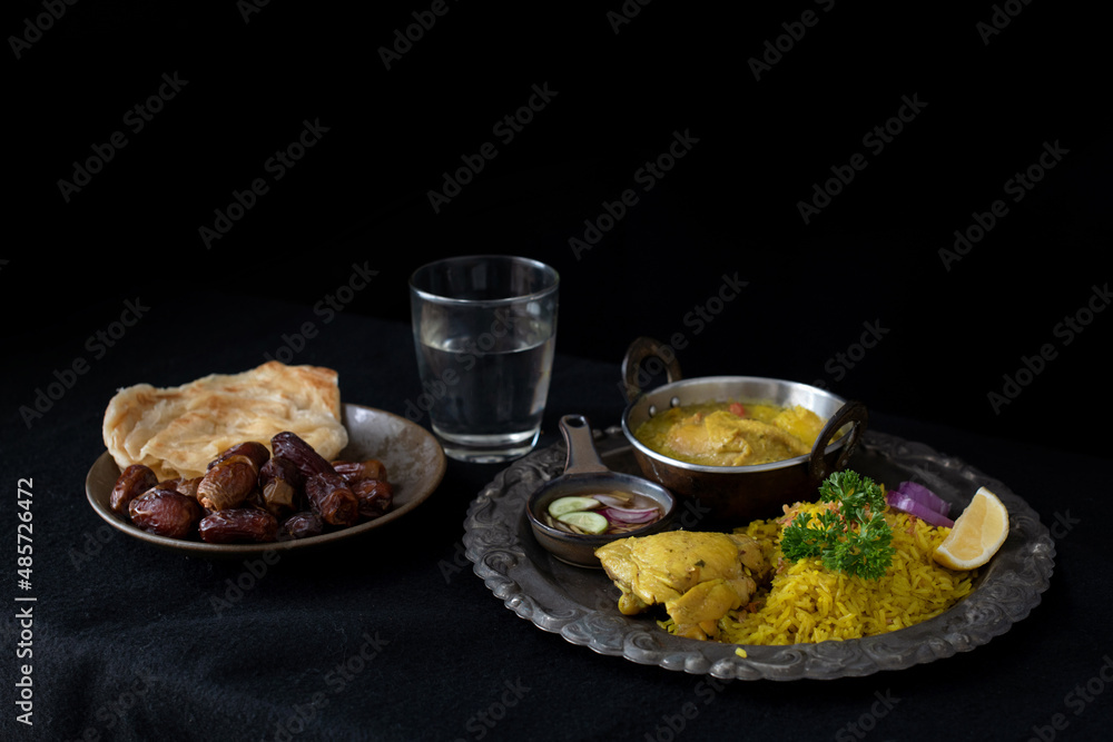 Chicken Biryani, traditional spicy Muslim food, yellow rice cooked with ...