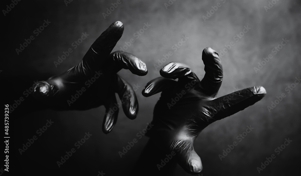 Background of hands in black gloves. Horror and hand monsters. Black ...