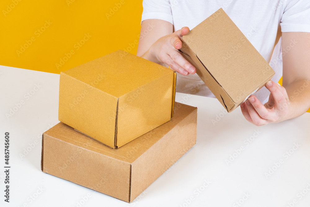 Cardboard boxes in woman hand. Woman hands with boxes. Concept of ...