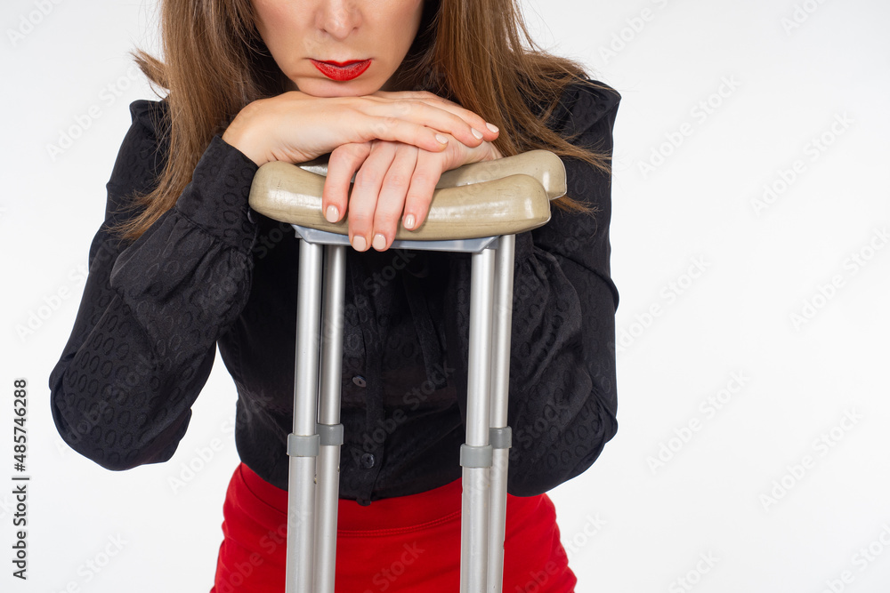 woman with crutches. Lady and two crutches. Girl is disabled. Person ...