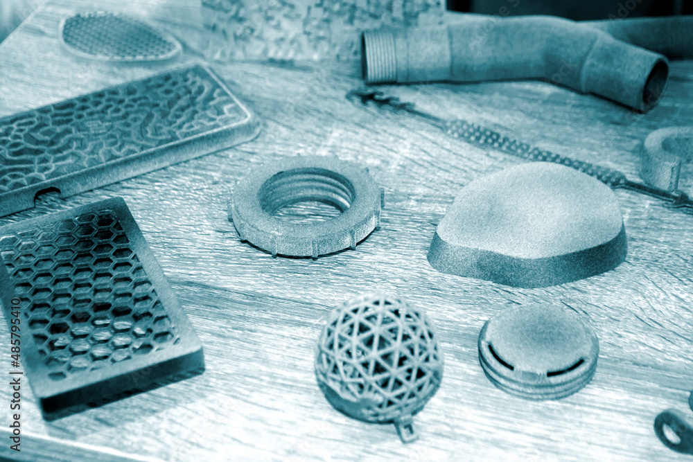 Different objects printed on industrial powder 3D printer. Multi Jet ...