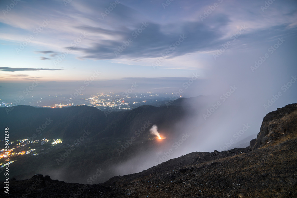 Sulhur gases and molten lava glow at the top of Sibayak Volcano at ...