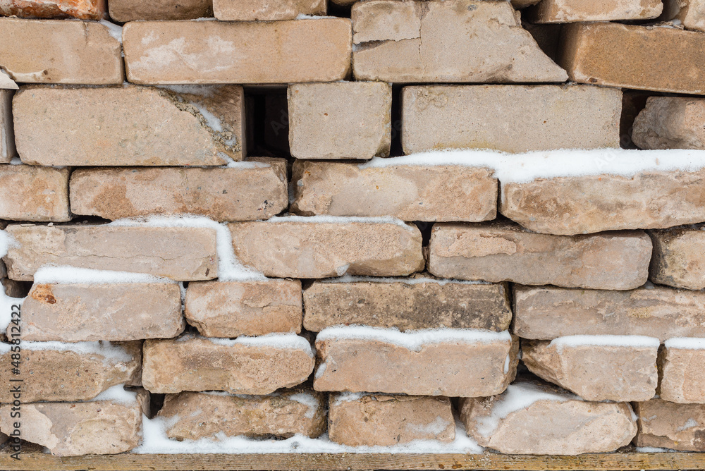 Heap of gray bricks close up. the pile of brick stones. the brown ...