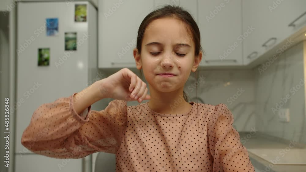 Upset preteen girl shedding tears, expressing sadness indoors. Unhappy ...