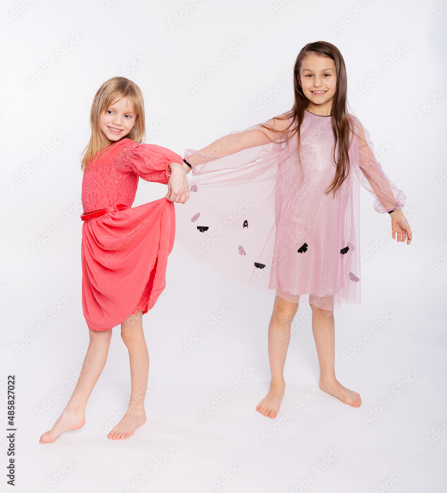 Playful kids, funtime concept. Portrait of cute two girls 6-8 years old ...