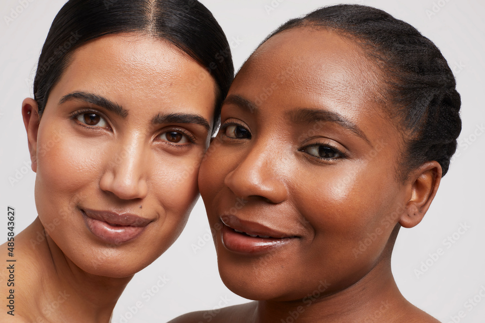 Close-up of two smiling women cheek to cheek Stock-Foto | Adobe Stock
