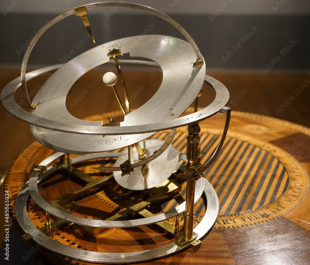 An orrery is a mechanical model of the solar system. Old vintage brass ...