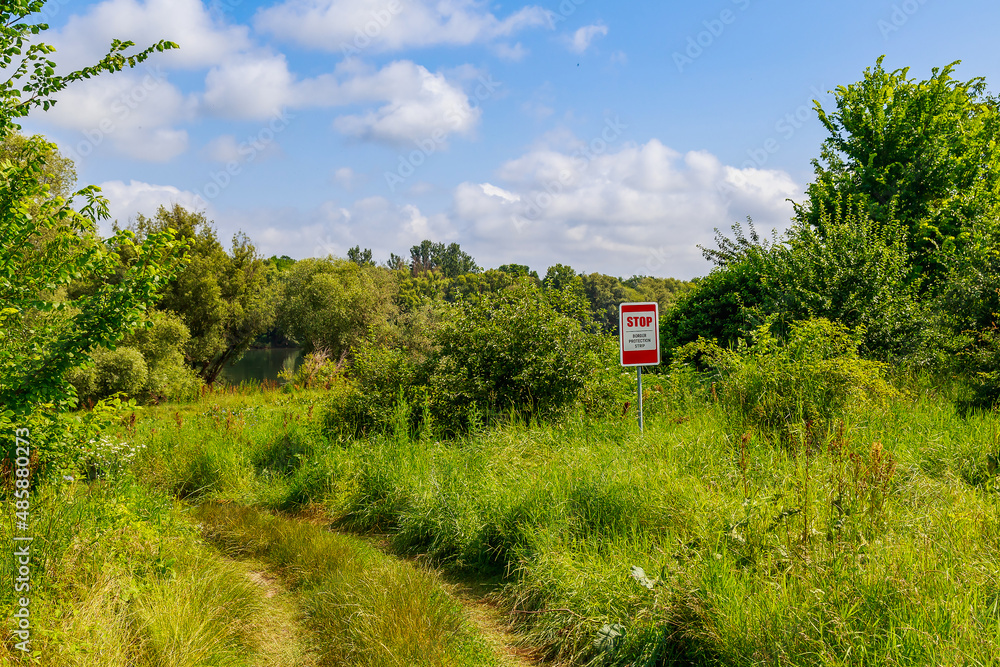 The inscription or text in English STOP BORDER PROTECTION STRIP ...