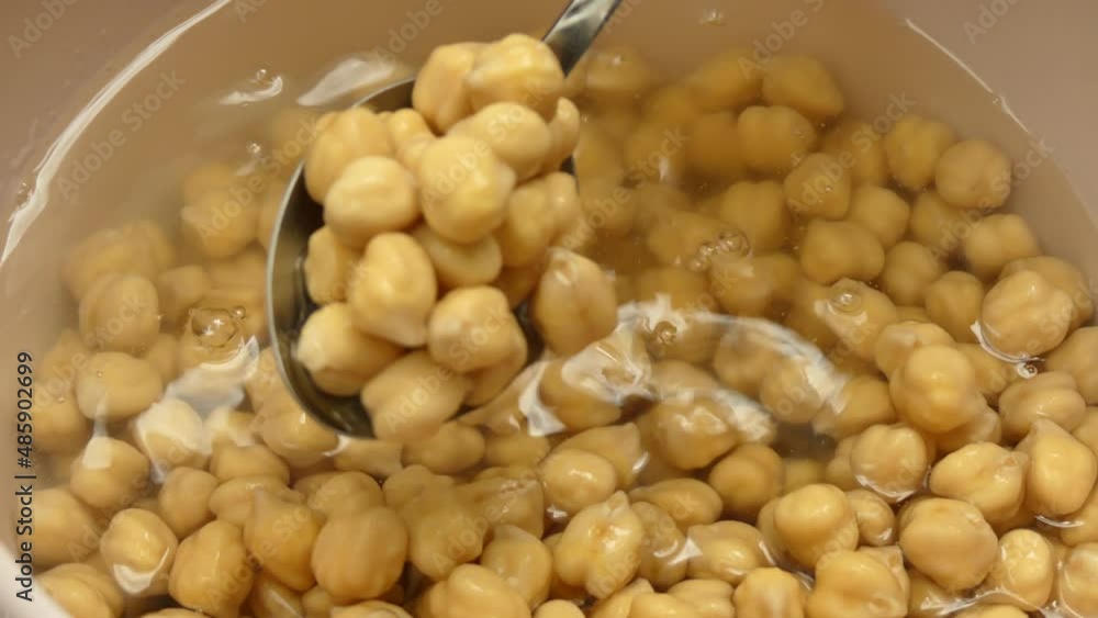 raw chickpeas pre-soaked for cooking, chickpeas soaked in water and ...