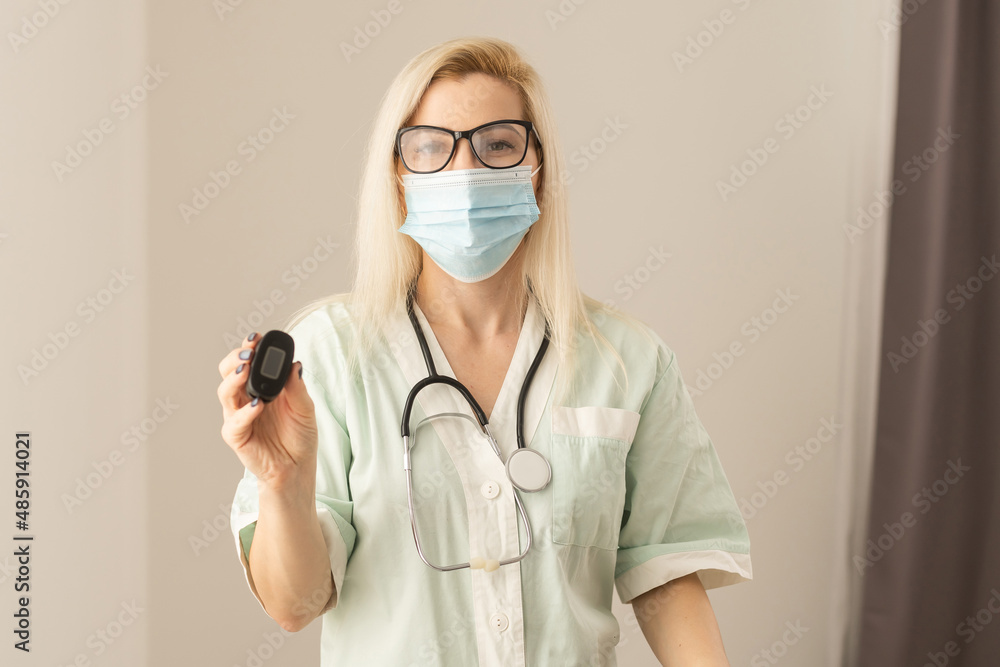 Doctor examining patient with fingertip pulse oximeter Stock Photo ...