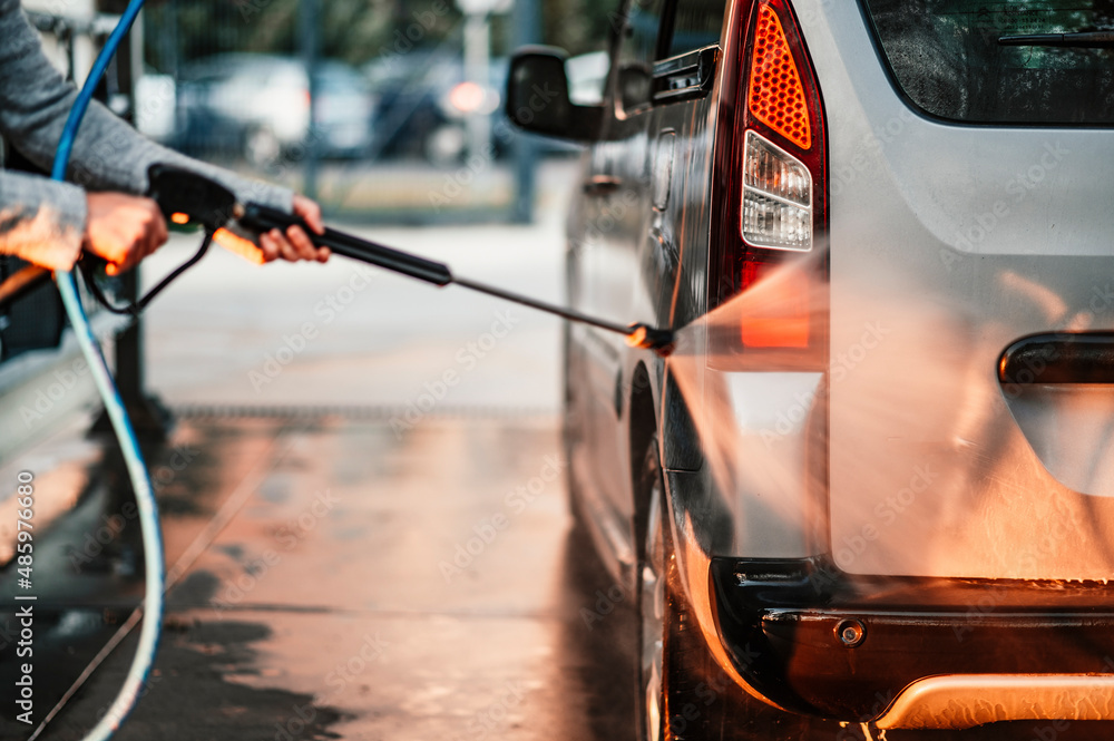 Manual car wash with white soap, foam on the body. Washing Car Using ...
