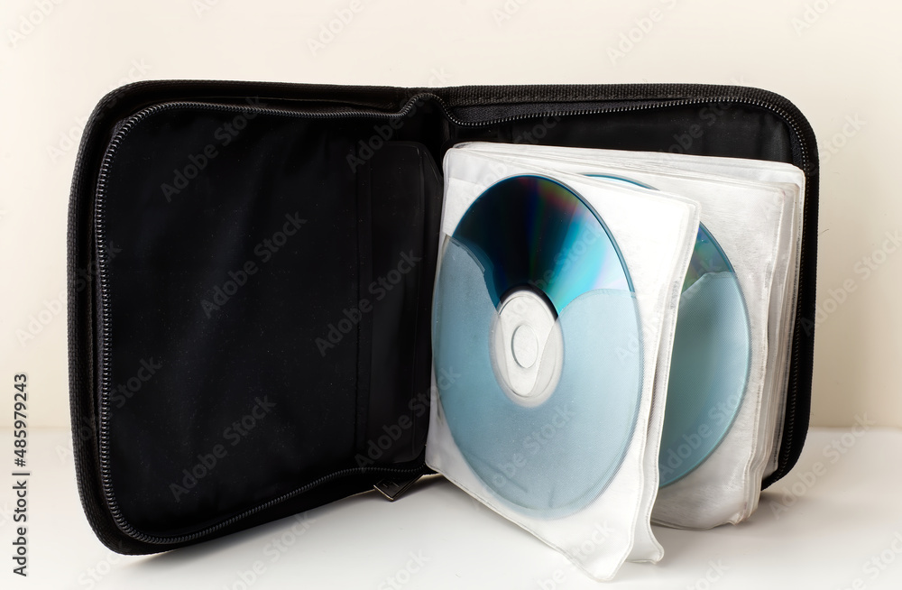 Black Case for CD and DVD on white background. Technology from the 90s ...