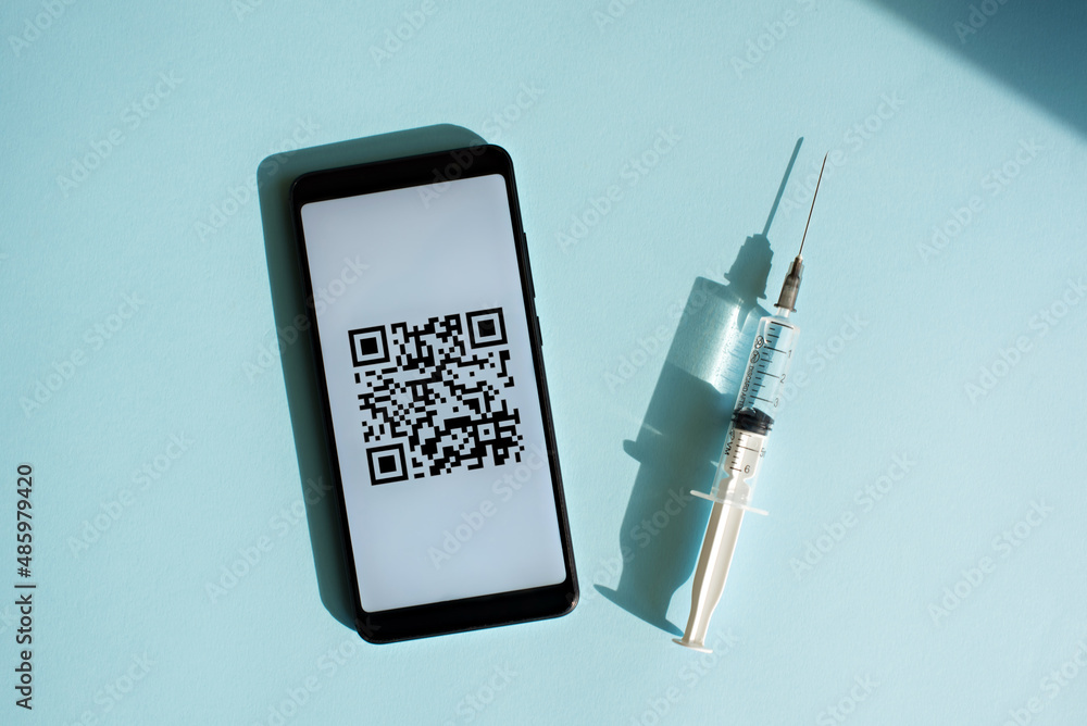 Smartphone with quar code of vaccination certificate on the screen ...