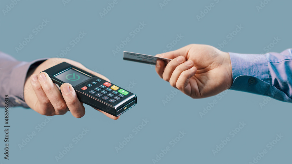 Customer paying with his credit card Stock Photo | Adobe Stock