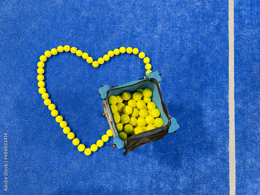 Padel balls in heart valentines on court Stock Photo | Adobe Stock