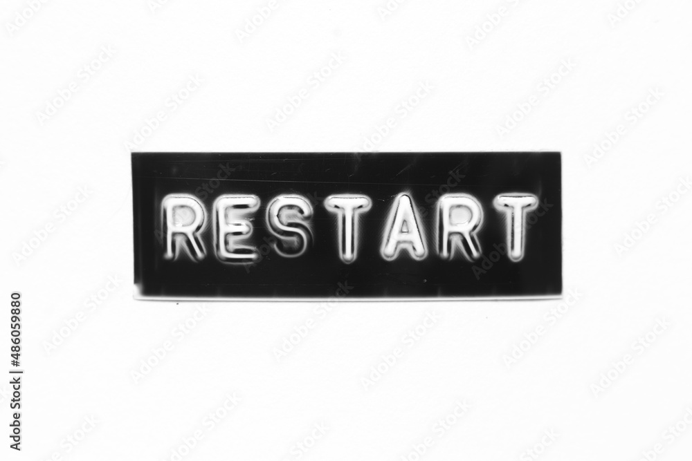 Black color banner that have embossed letter with word restart on white ...