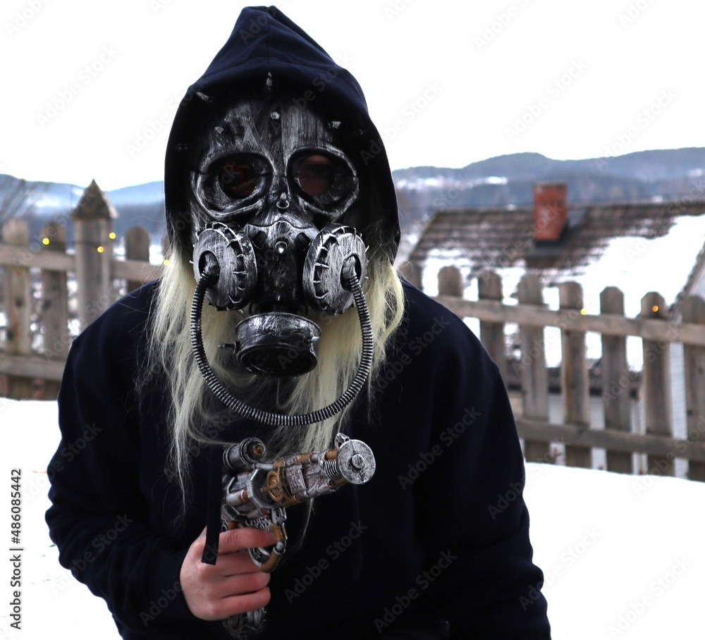 Armed steampunk person sitting spying and keeping low profile with gas ...