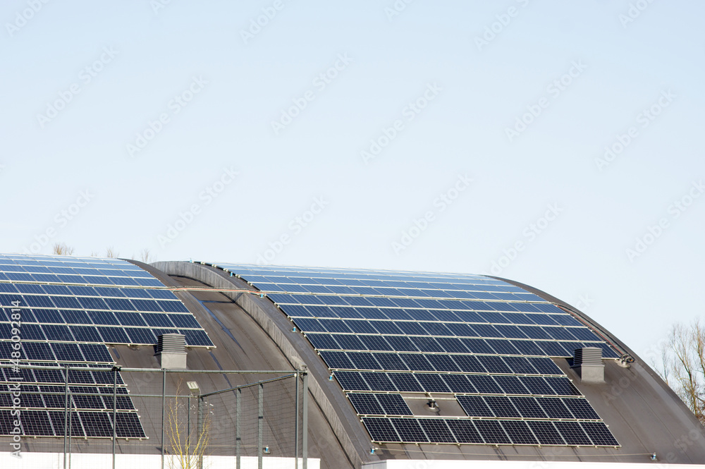 Large curved roof with solar panels for electric power generation in ...