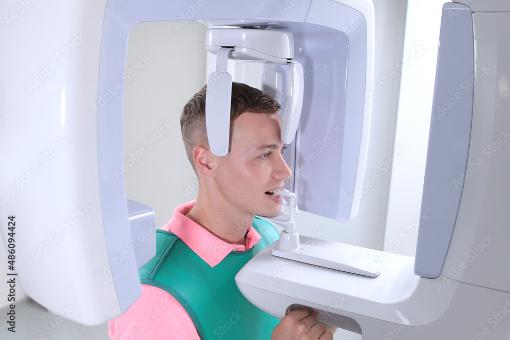 X-ray room in a modern dental clinic. Modern dentistry. A patient in a ...