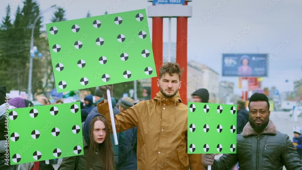 Multicultural diverse crowd of political protesters with green screen ...