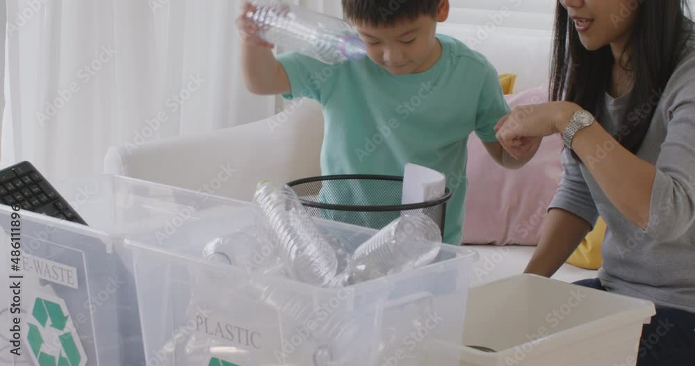 Mom teach Gen Z preteen boy kid dump paper glass can e-waste bag in ...