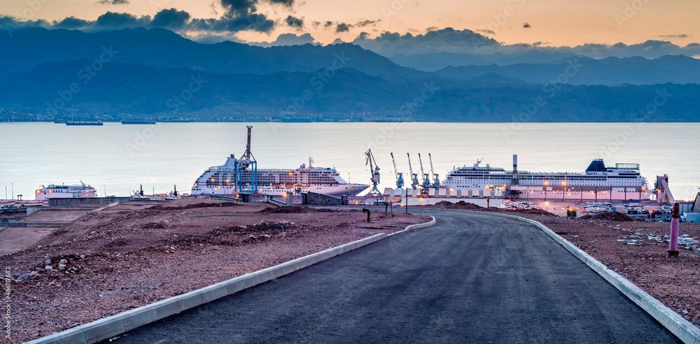Road leading to marine port on the Red Sea with anchored passenger ...