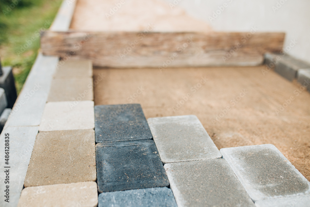 Professional laying of road stone and paving slabs for walking and ...