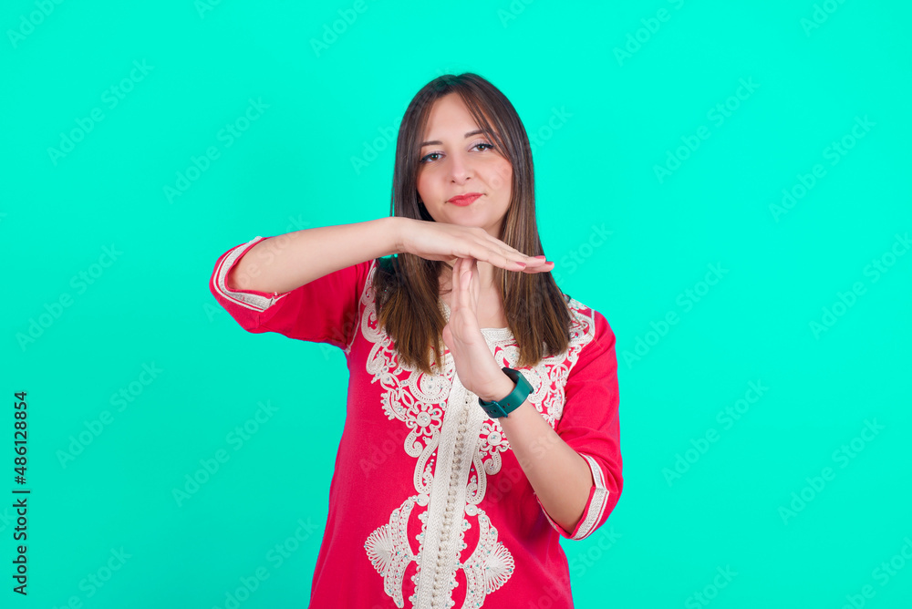 young beautiful moroccan woman wearing traditional caftan dress over ...