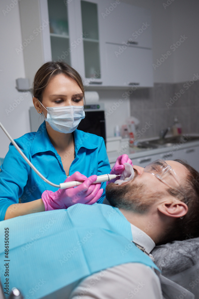Macro photography. Top view on cleaning process in patient's mouth ...
