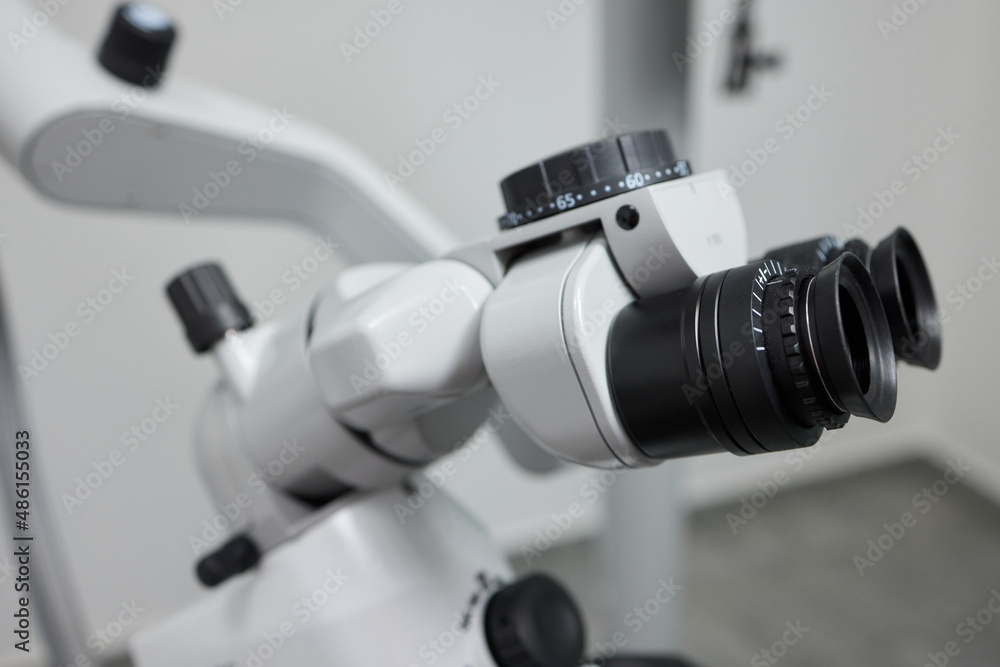Dental microscope on the background of modern dentistry. Medical ...