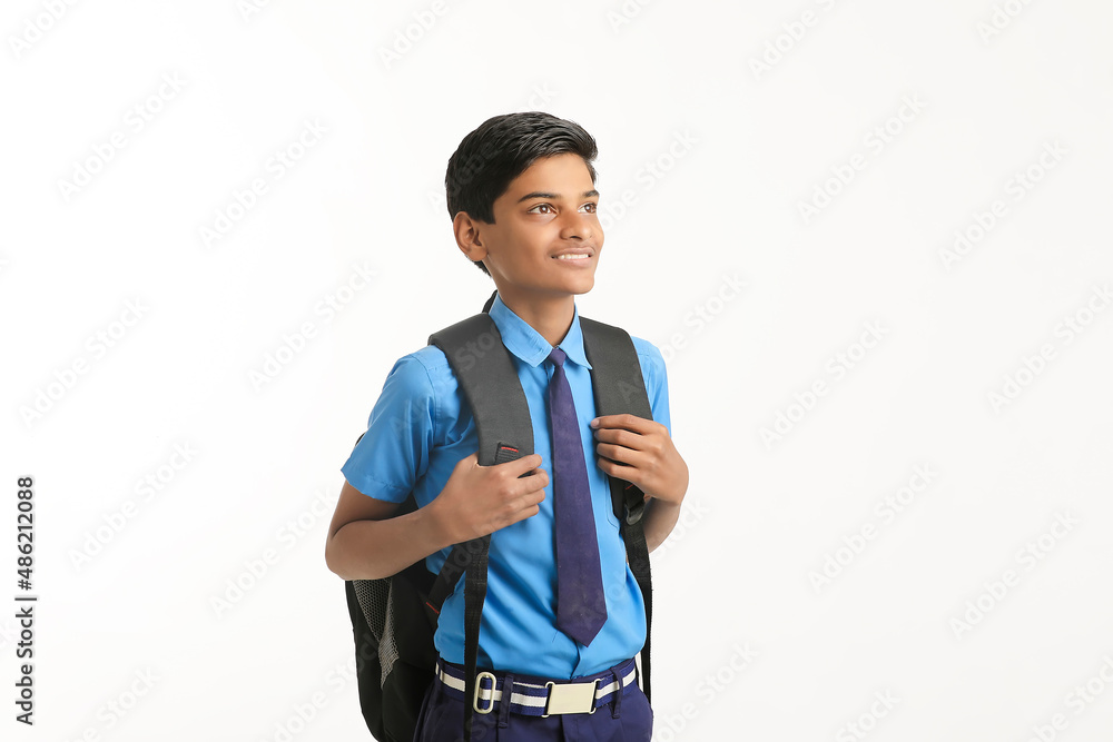 Indian school boy standing on white background. Stock Photo | Adobe Stock