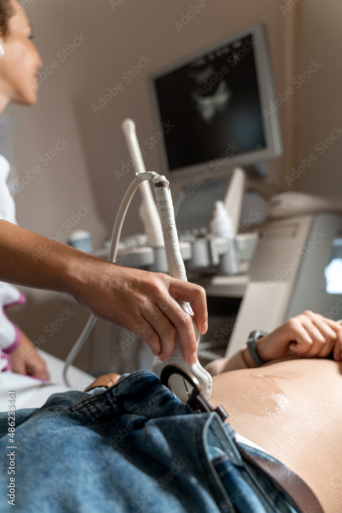 Ultrasound diagnostics of the stomach on the abdominal cavity of a girl ...