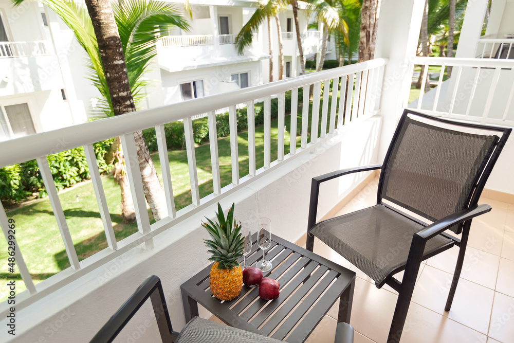 Romantic tropical setting on balcony with palm tree garden Stock Photo ...
