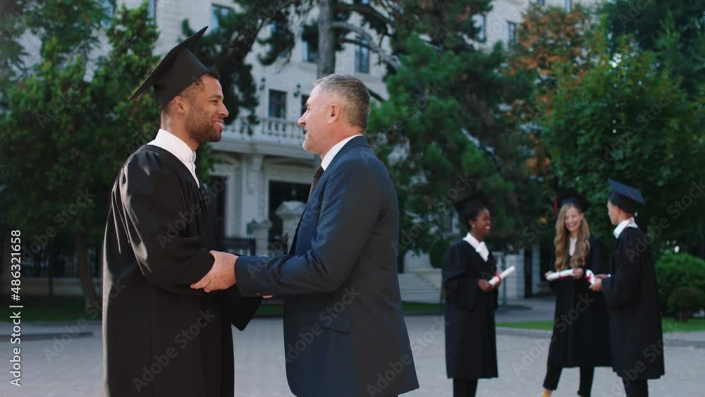 In the college garden graduation day college professor old man congrats ...