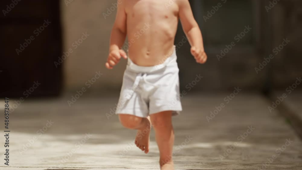 Kid running outside shirtless active little boy runner Stock Video ...