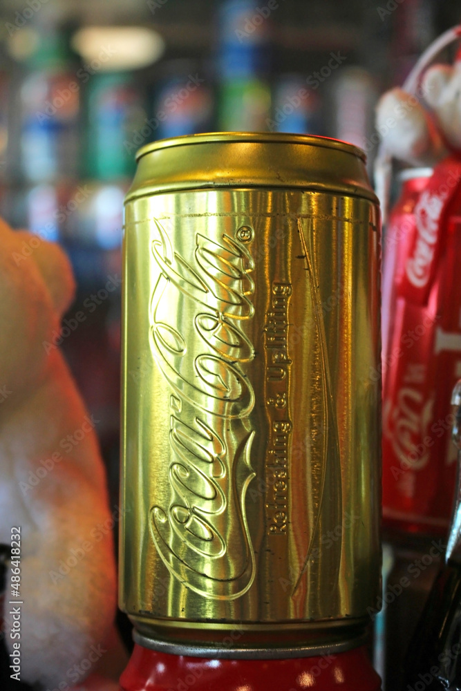 Rayong, Thailand - April 8th, 2017: A collectible all gold Coca-Cola ...