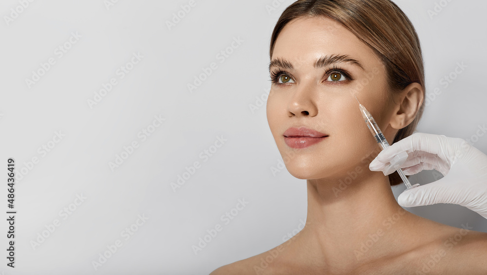 Beautiful woman receives anti wrinkle beauty injection for facial ...