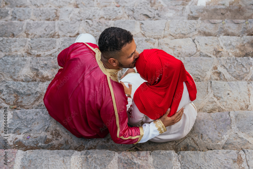 high angle photo of an arab man kissing his Muslim girlfriend on the ...