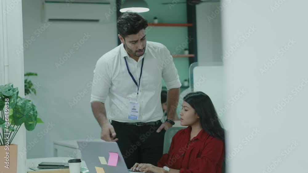 Indian man boss getting angry at his staff Asian female employees ...