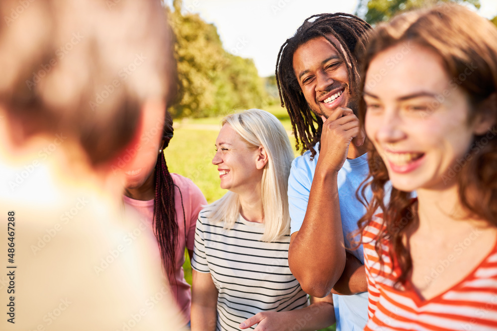 Group of friends talking to each other in the summer in the park Stock ...