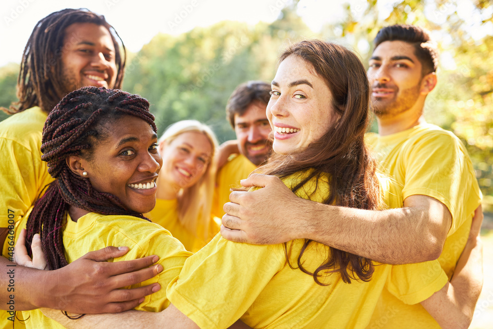 Multicultural people in the start-up team hug each other Stock Photo ...