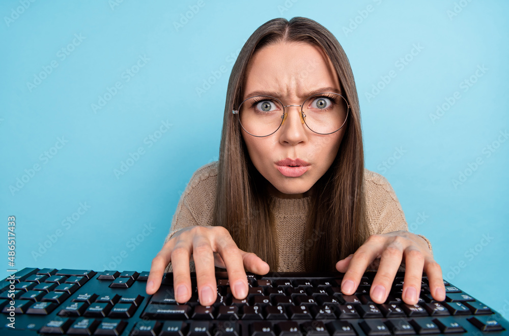 Portrait of attractive focused tense funny girl typing playing strategy ...