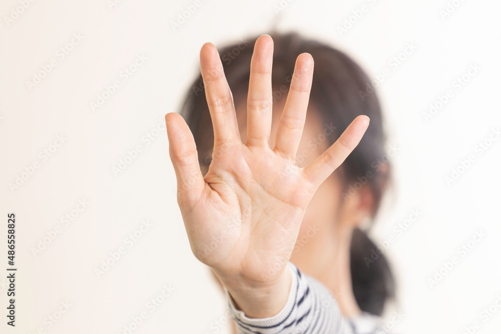 Hand gesture Stop, No. Woman rises her hand up, covering her face and ...