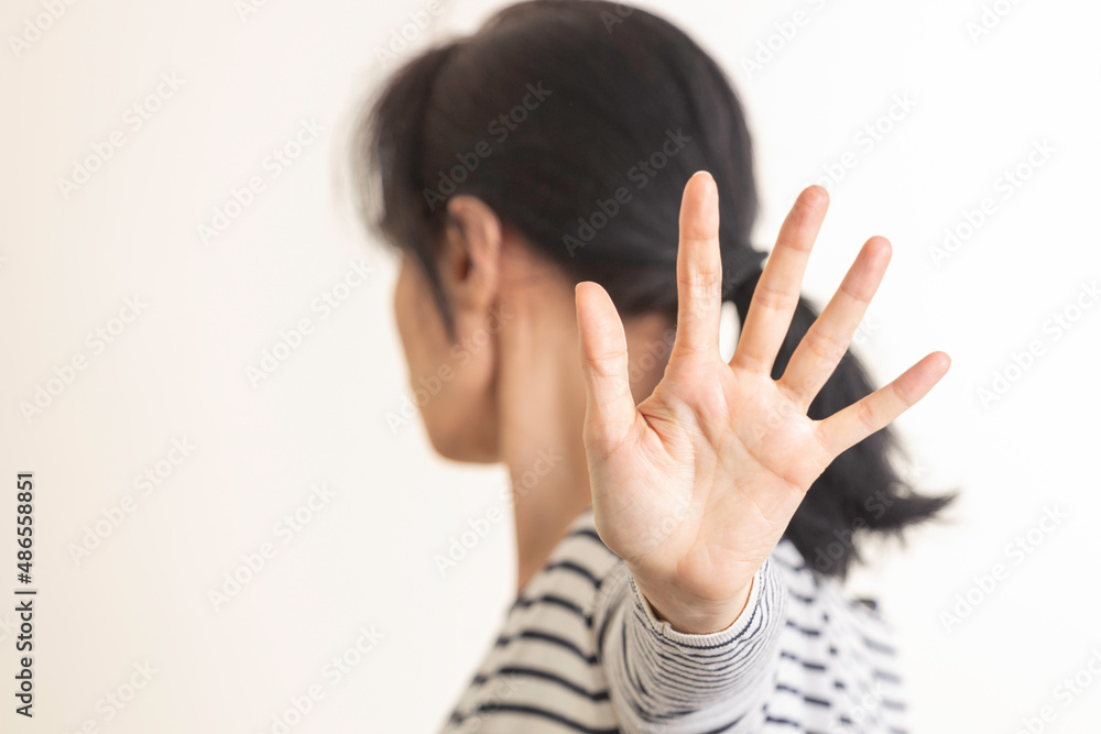 Hand gesture Stop, No. Woman rises her hand up, covering her face and ...