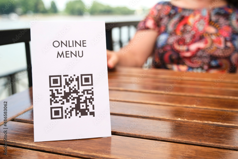 Table with a QR code to access a restaurant digital menu Stock Photo ...