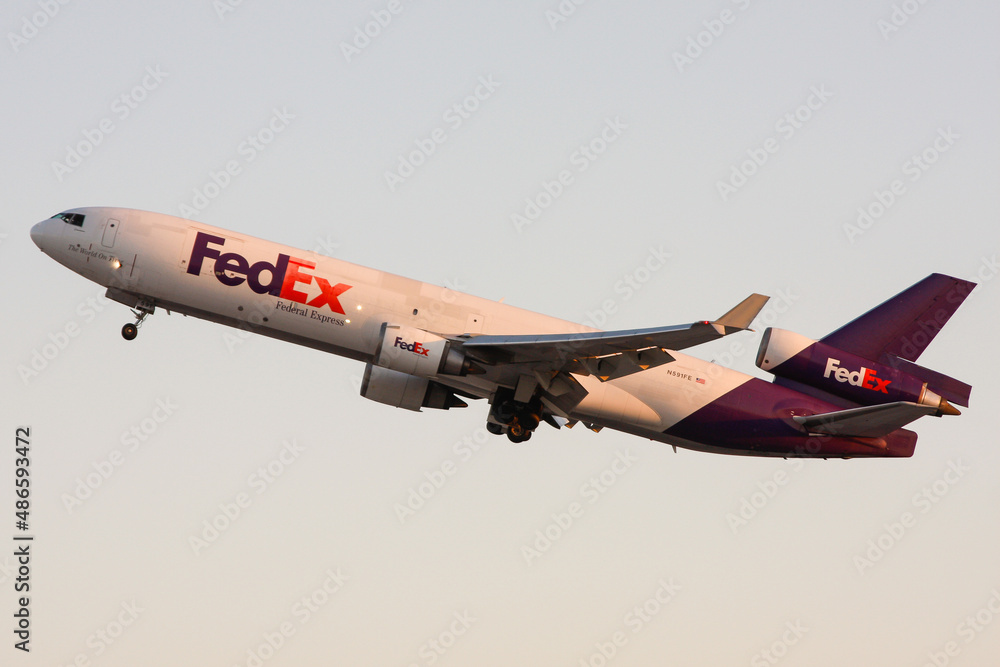 FedEx cargo jet aircraft departing Los Angeles early in the morning ...