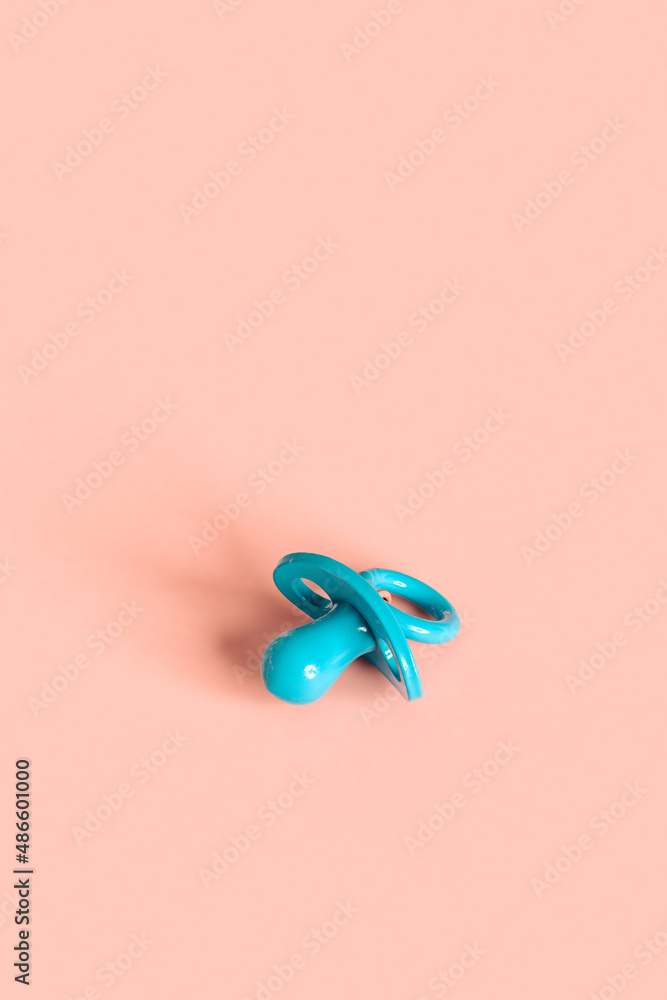 blue pacifier on pink background with large copy space Stock Photo ...