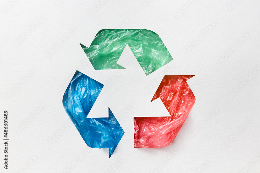 Recycle sign made of colored plastic bags Stock Photo | Adobe Stock